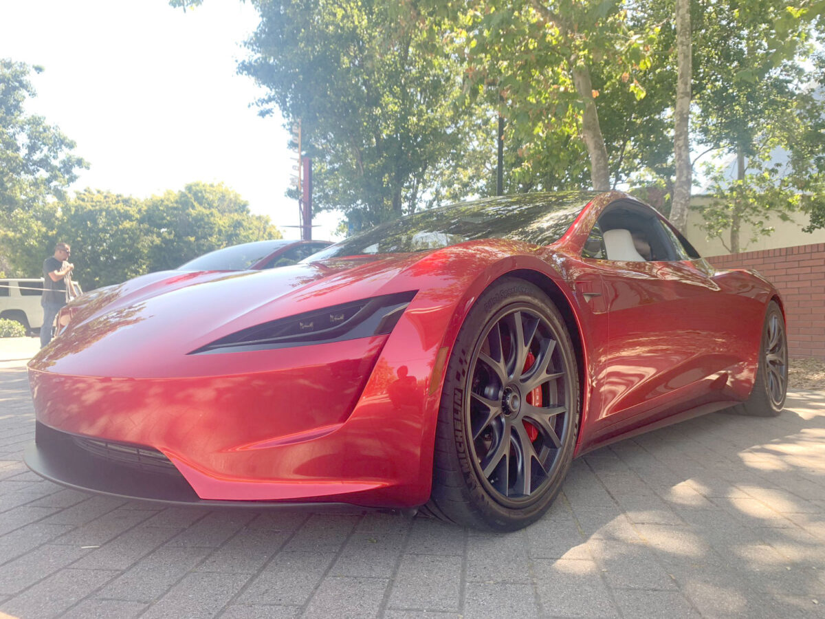 Red Tesla Semi, Roadster, and Model Y greet the participants at the ...
