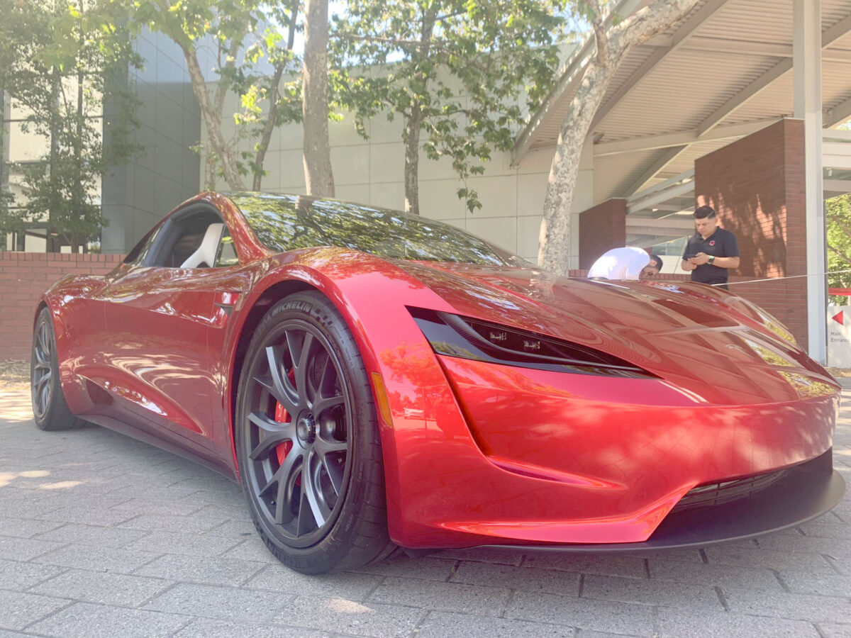 Red Tesla Semi, Roadster, and Model Y greet the participants at the ...